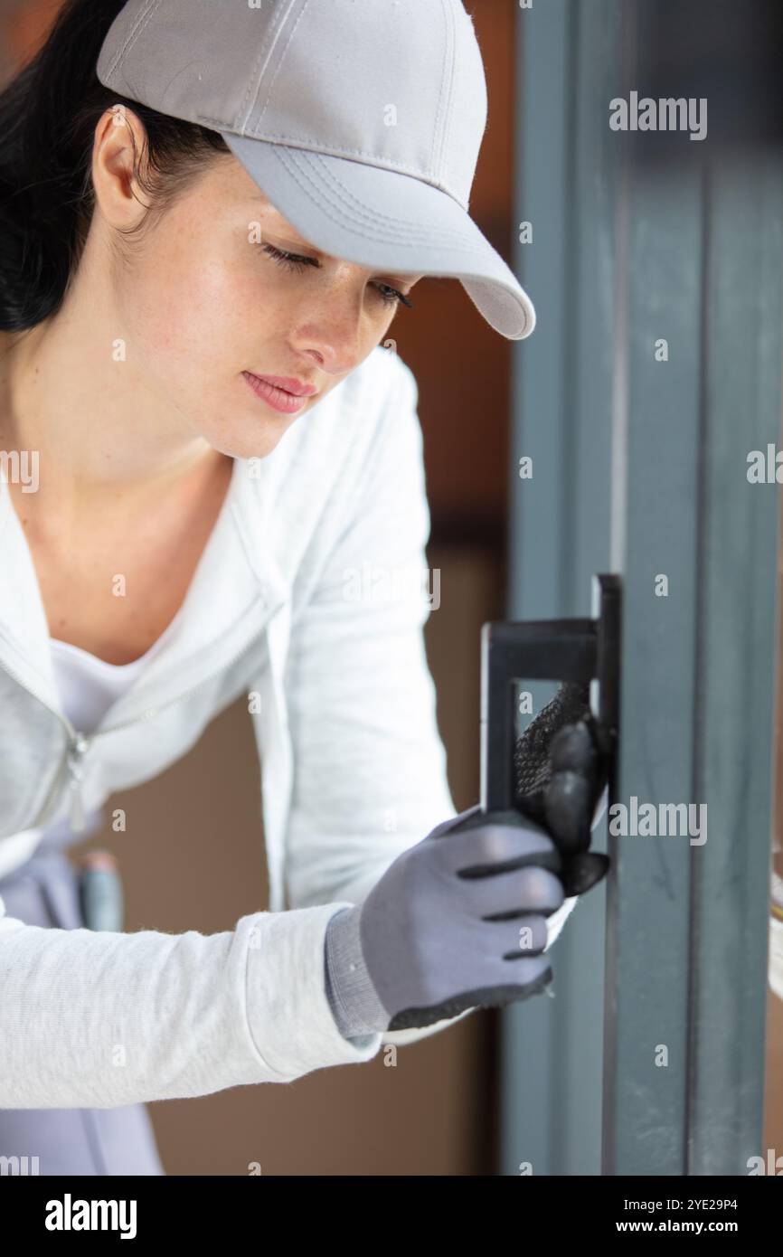 window setter inspecting the window Stock Photo - Alamy