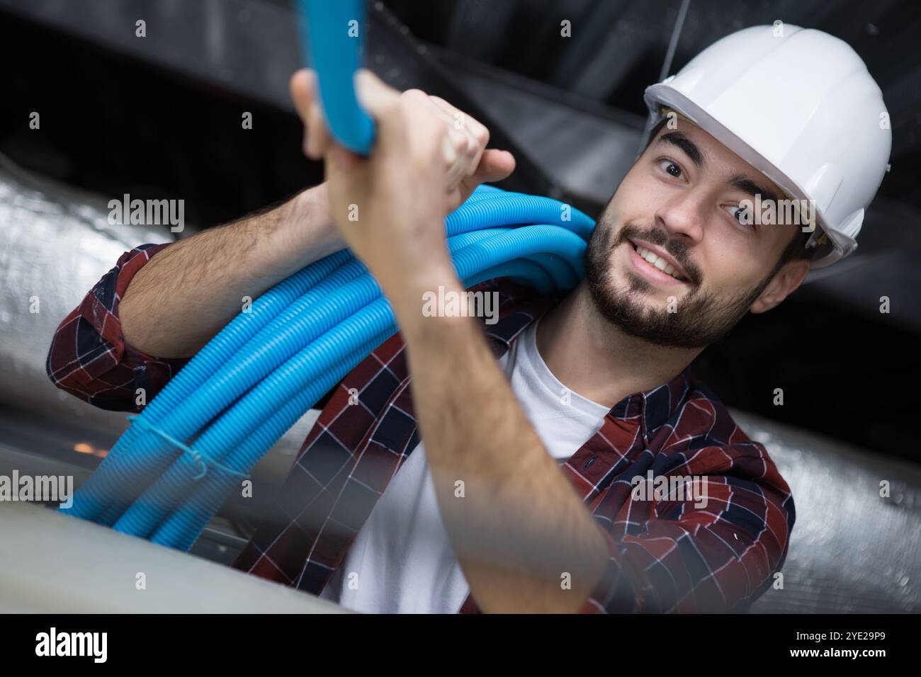 pipe worker fix problem in construction site Stock Photo - Alamy