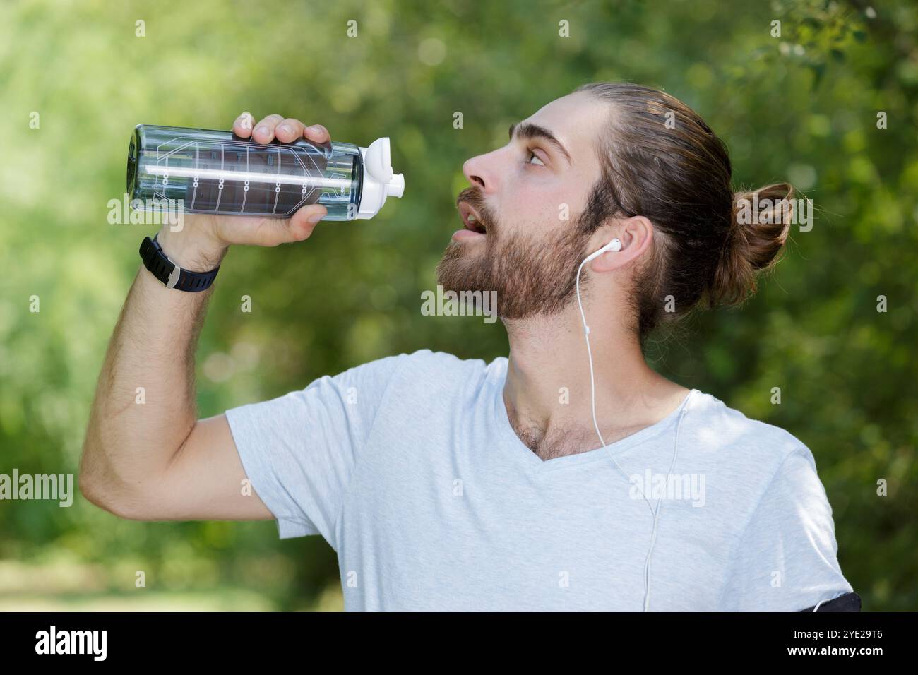 men drinking water in the forest Stock Photo - Alamy