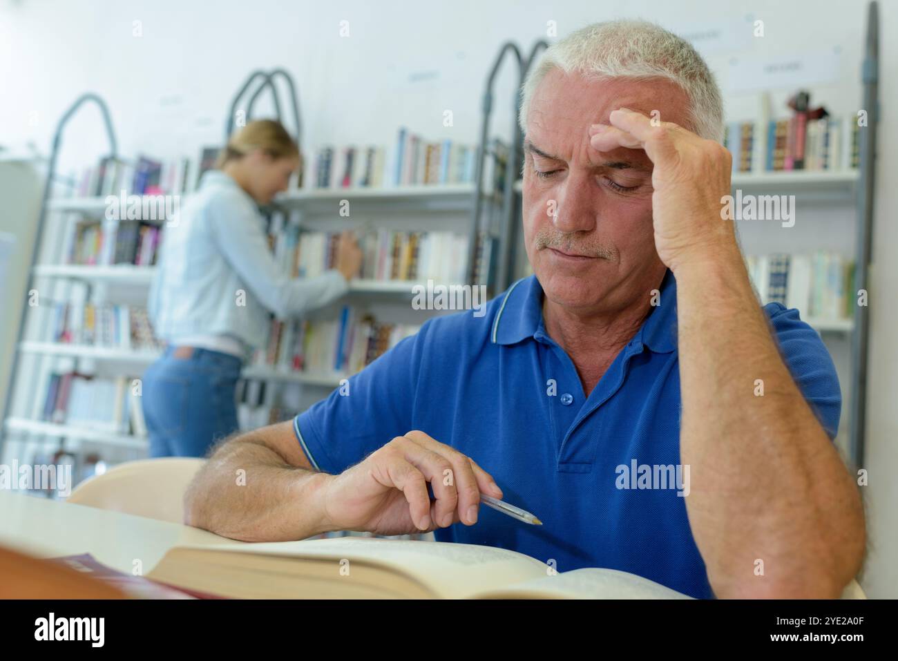 Elderly people reading in library hi-res stock photography and images ...