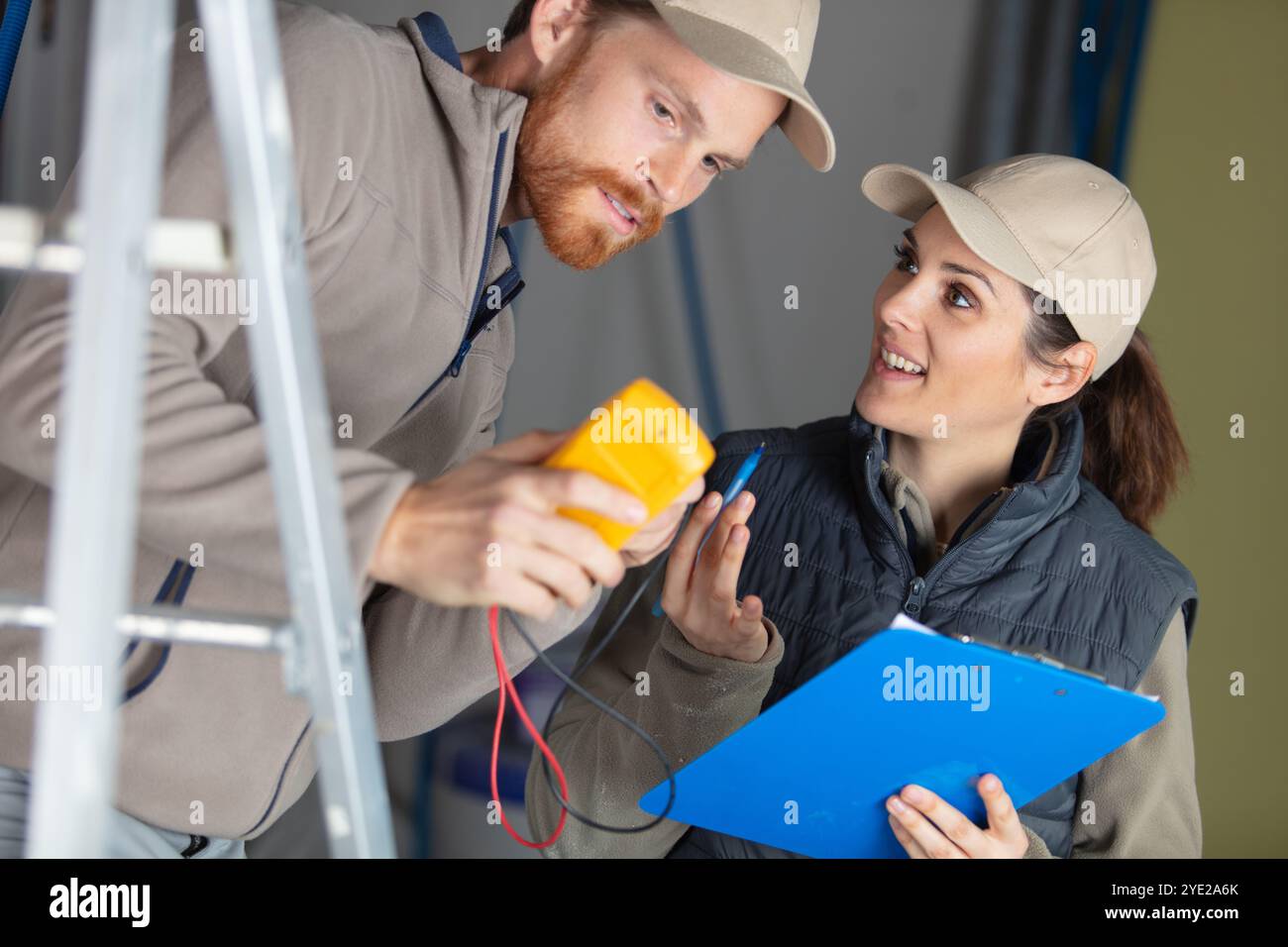 teacher observing students working on electrical circuits Stock Photo ...
