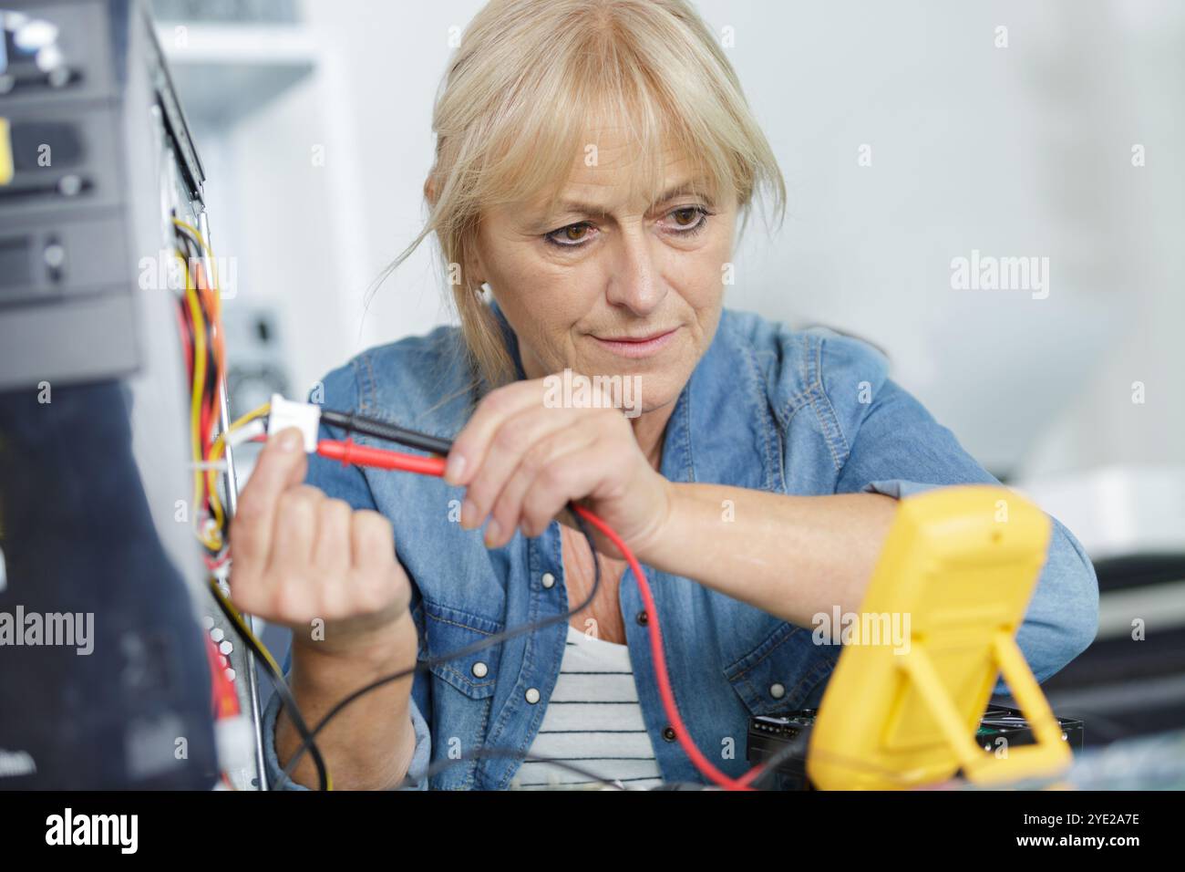 checking computer with a multimeter Stock Photo - Alamy