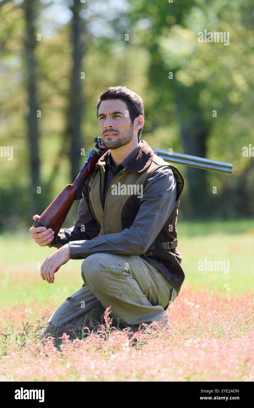 Man holding gun waiting hi-res stock photography and images - Alamy