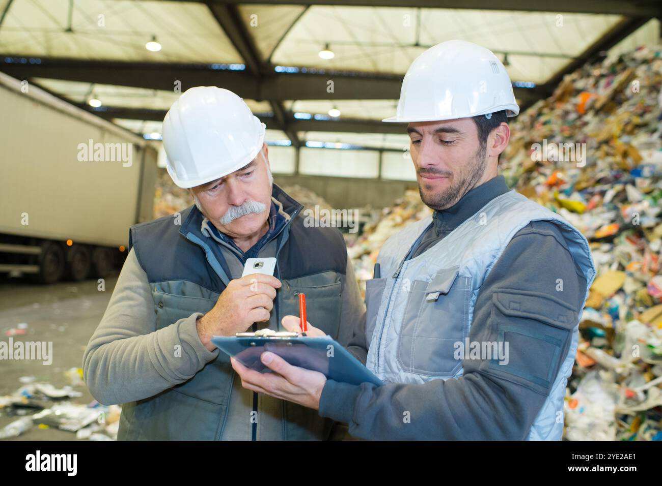 Worker in garbage factory hi-res stock photography and images - Alamy