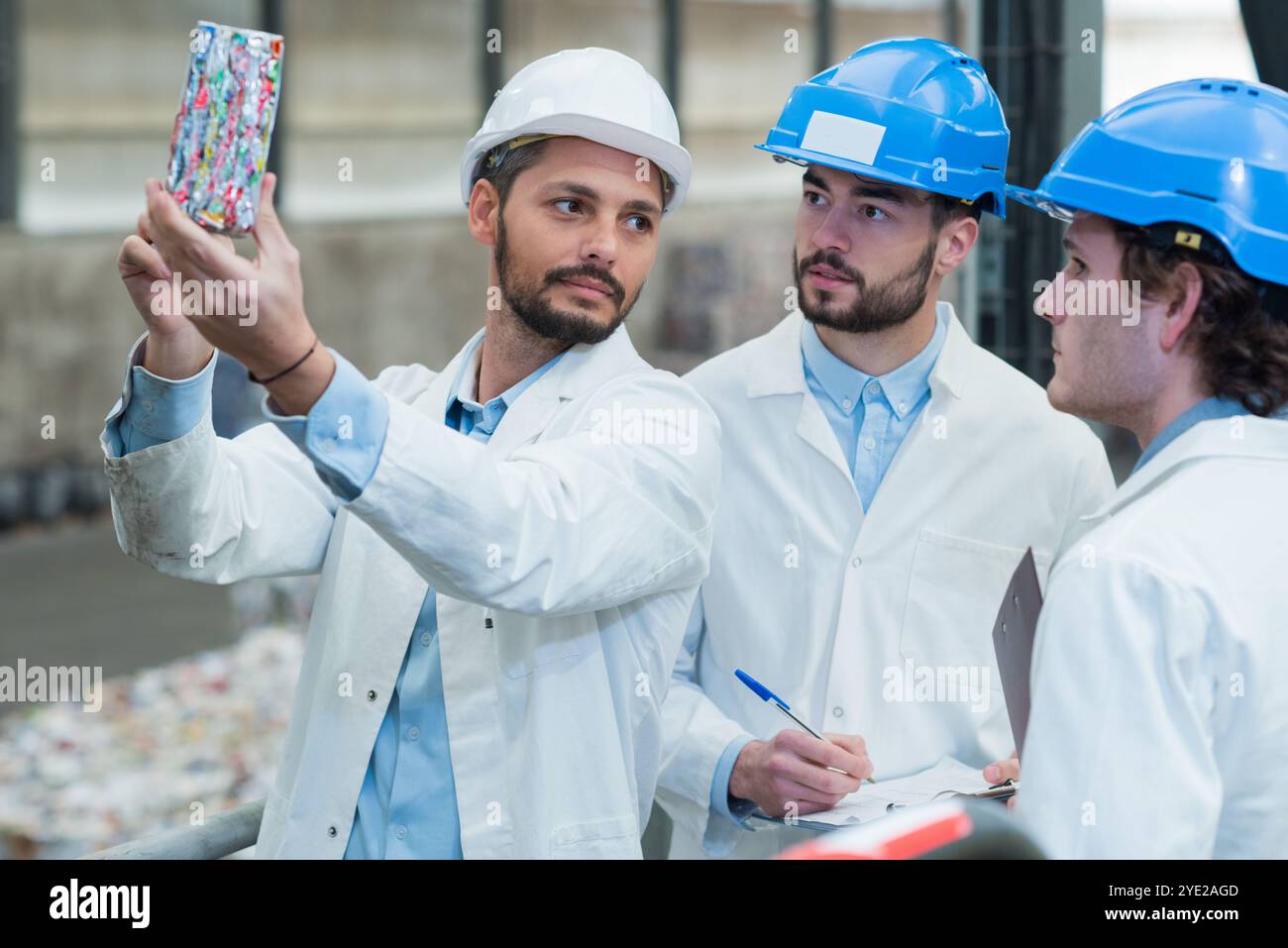 young workers in a junkyard Stock Photo - Alamy