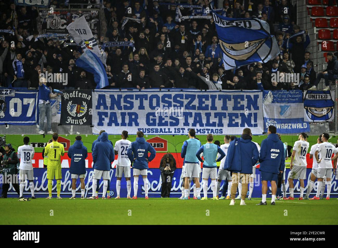 TSG 1899 Hoffenheim players in front of banner, fan poster, banner ...