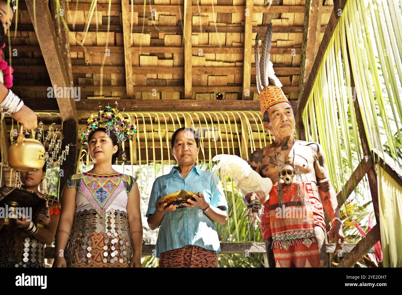 Ramping, an elder, holding a white chicken as a symbol of sincerity ...
