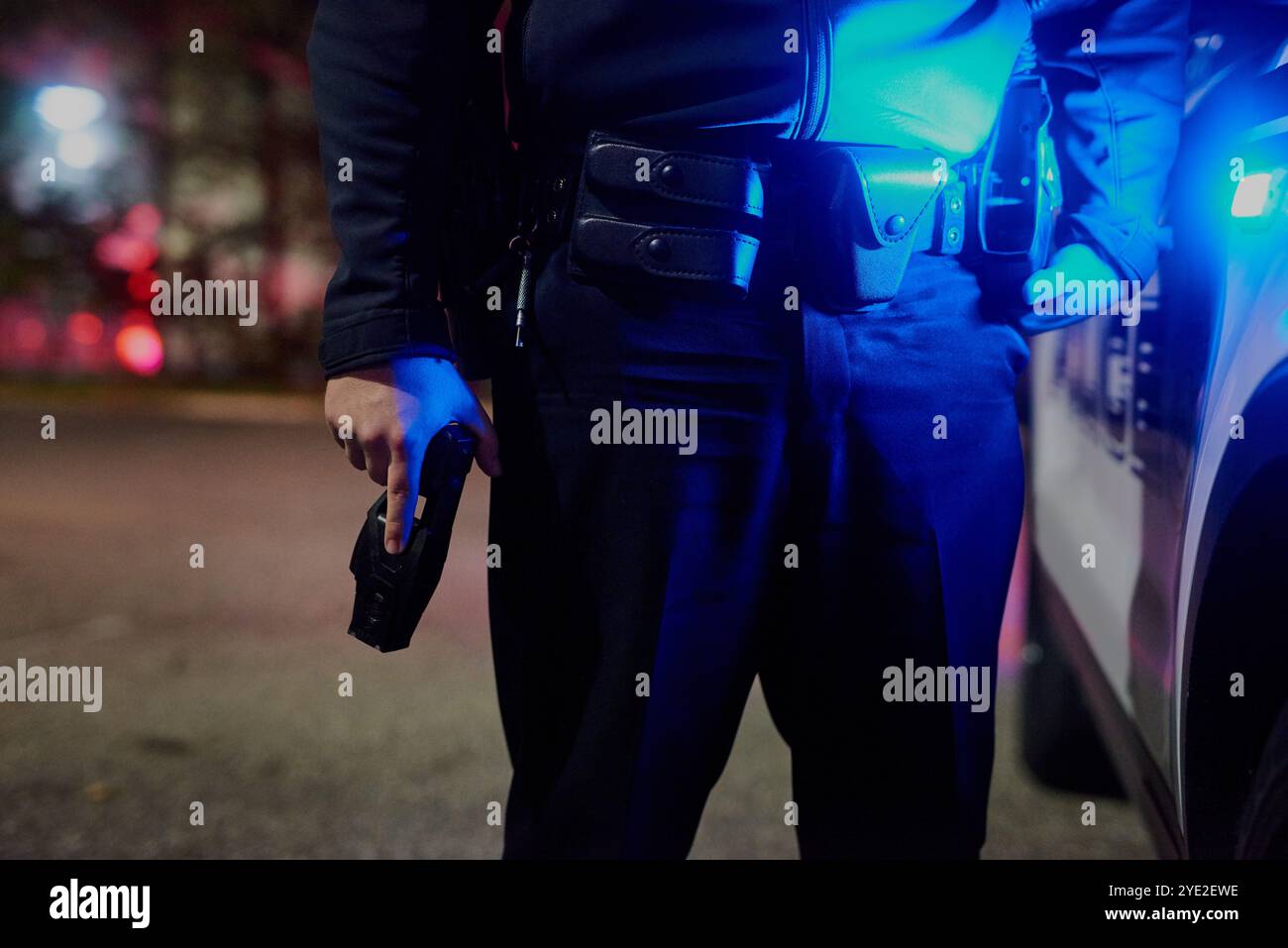 Police, gun and detective with hand of man at night for crime ...