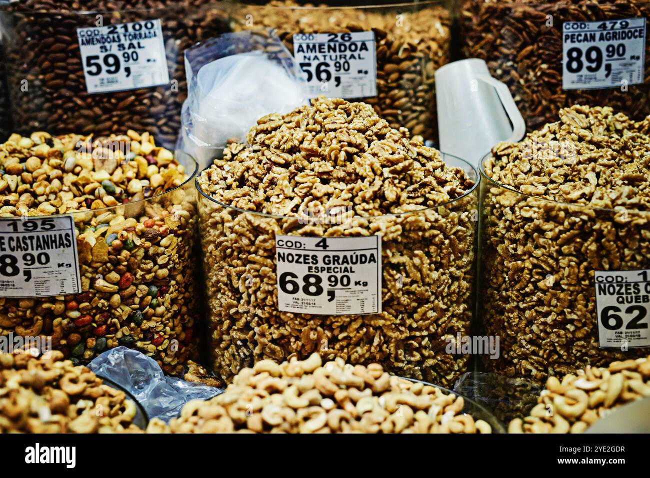 Container, nuts and market with price label in store for grocery ...