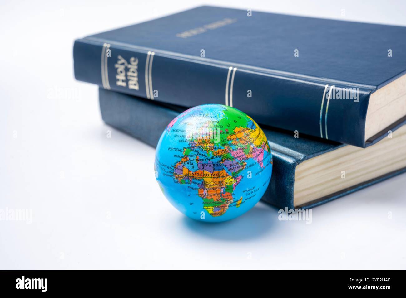 Book of Holy Bible with globe. It is laying on white background. Symbol ...