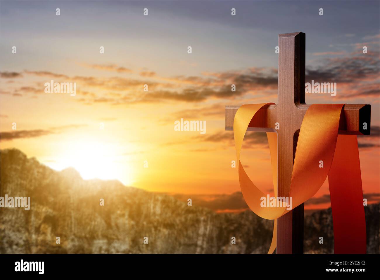 Religion christianity cross and orange ribbon with sunlight background ...
