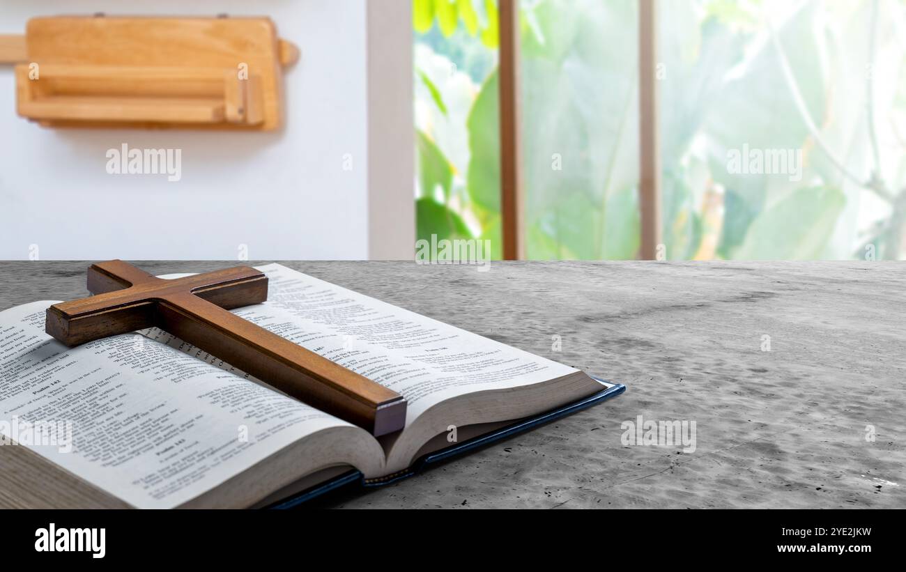 Religion cross and opened book of Holy Bible. Symbol of faith and ...