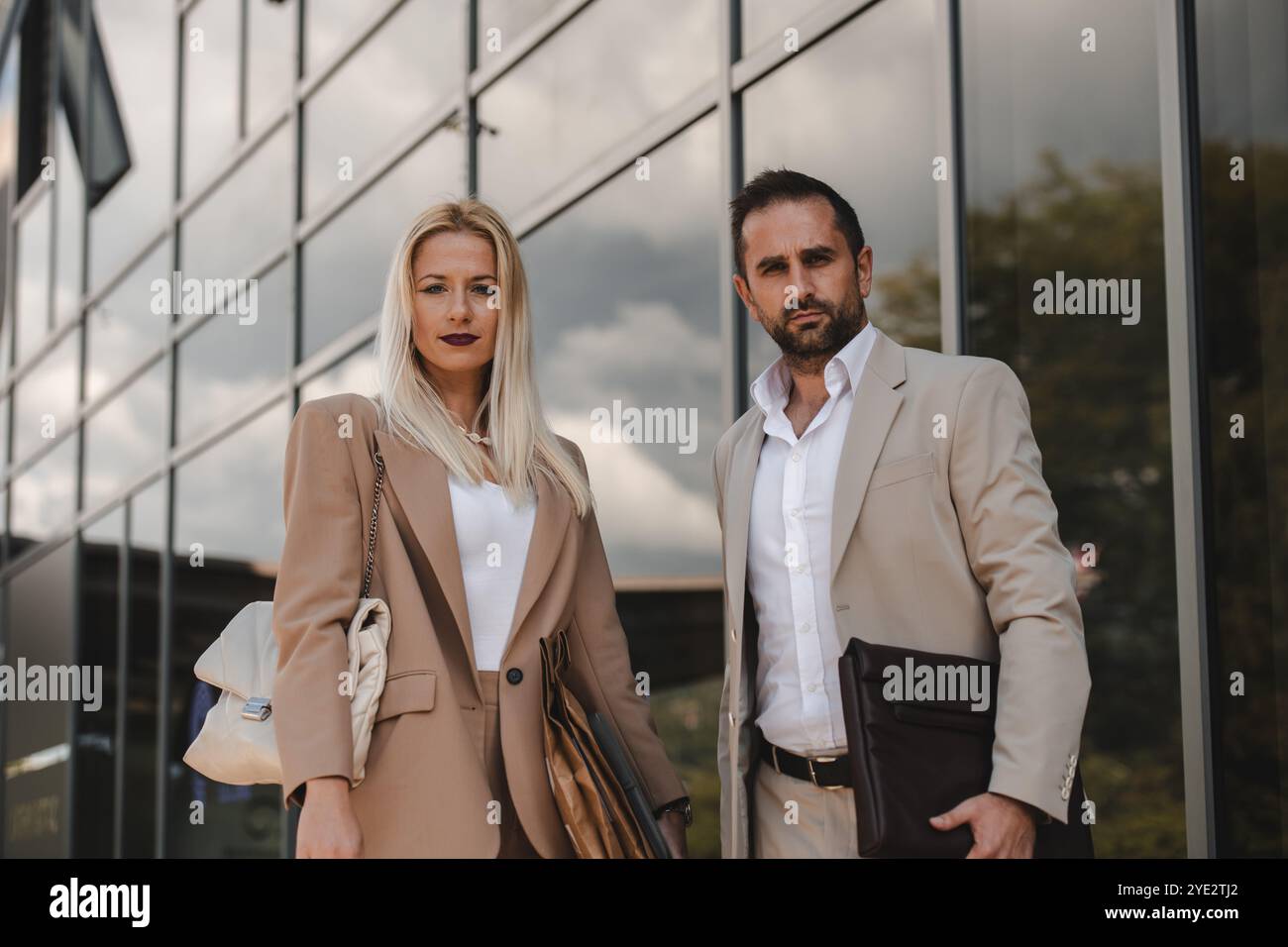 Modern business couple after a long day's work, walking together ...