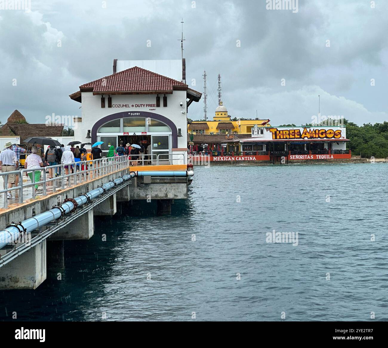Cruise ship passengers walkiing down Puerta Maya Pier, Cozumel ...