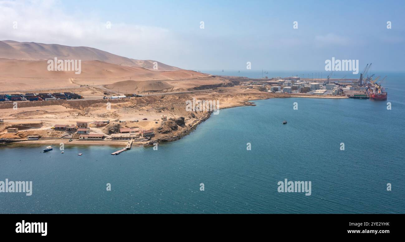 A beautiful blue ocean with a small town on the shore, the port in ...