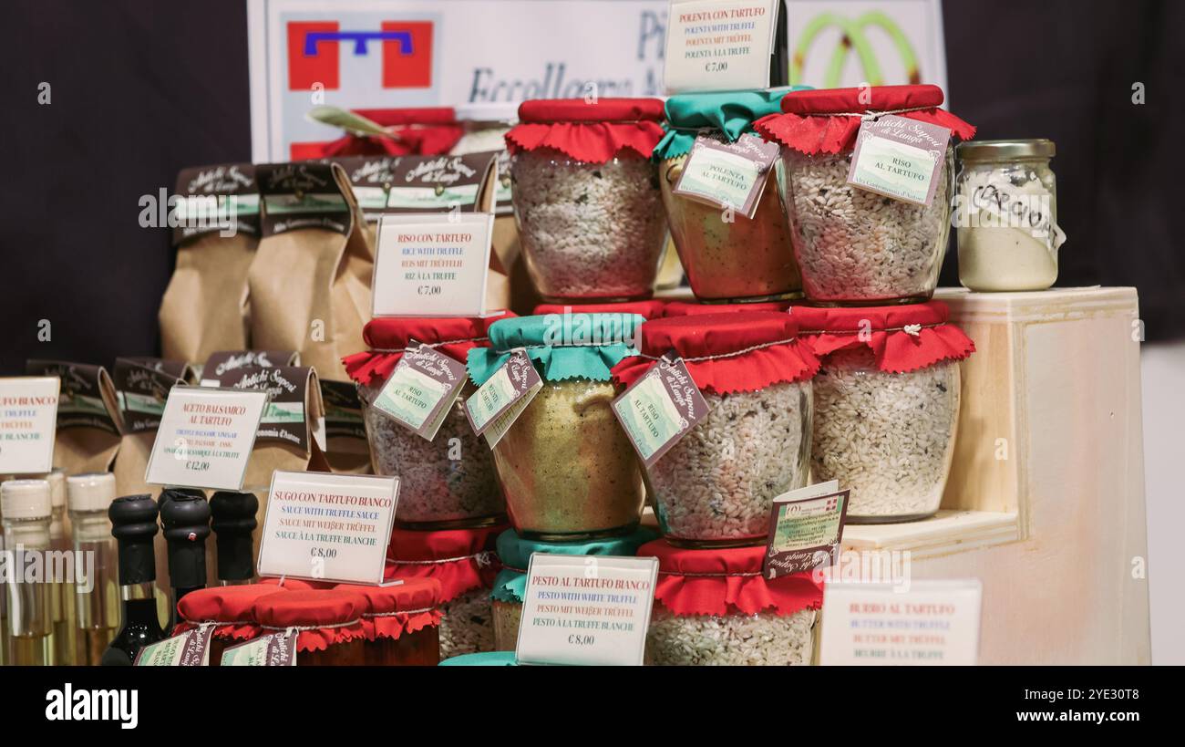 Visitors enjoy a vibrant display of jars filled with truffle products ...