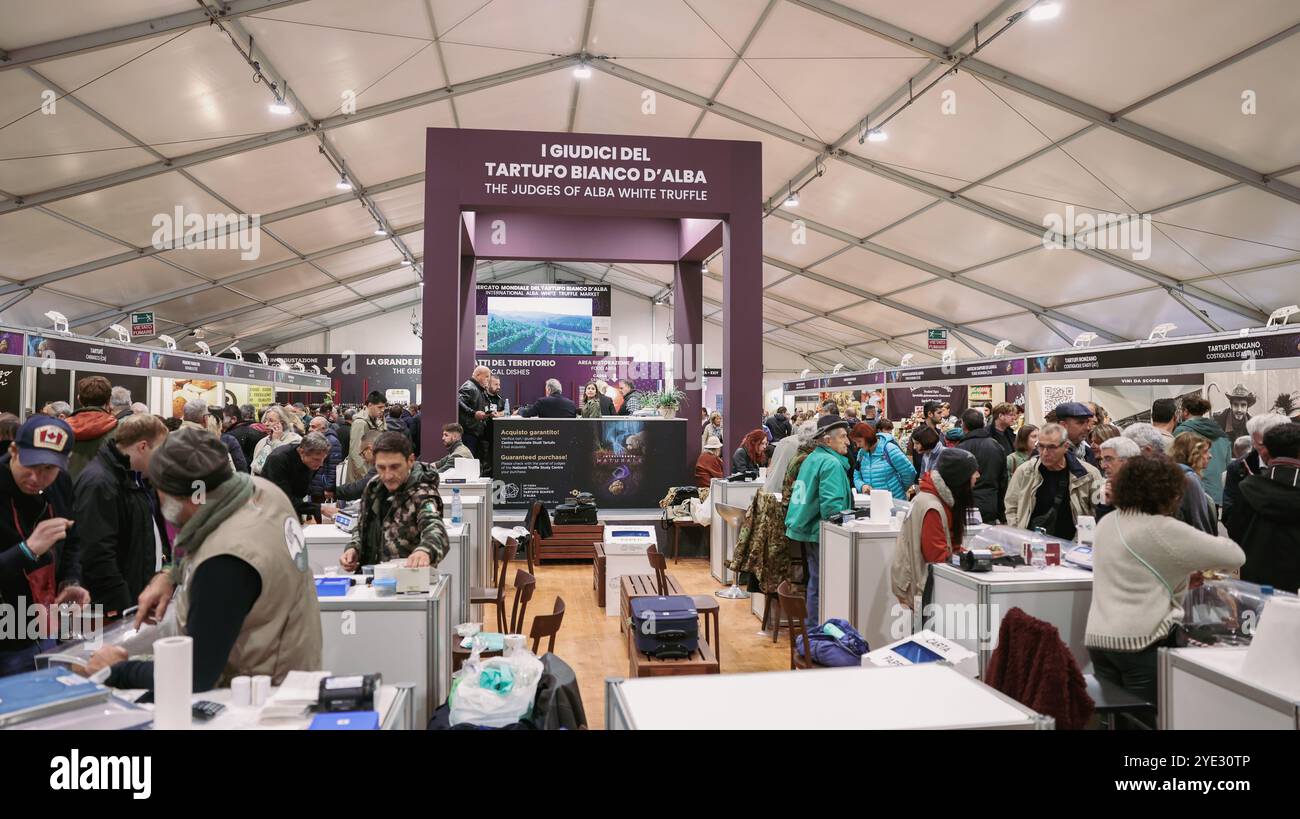Visitors explore the Alba Truffle Festival in Italy, engaging in ...