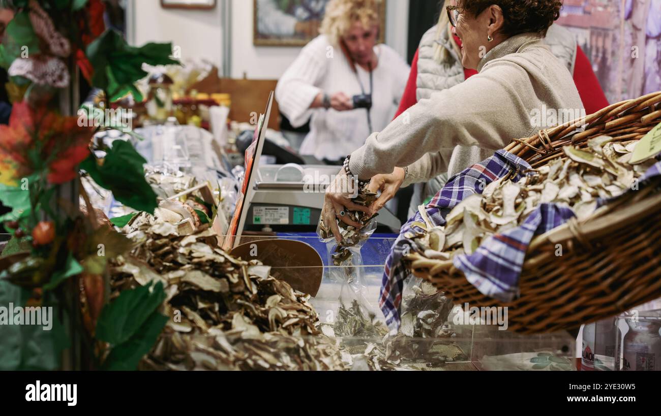 Visitors engage in the Alba Truffle Festival, where artisans present an ...