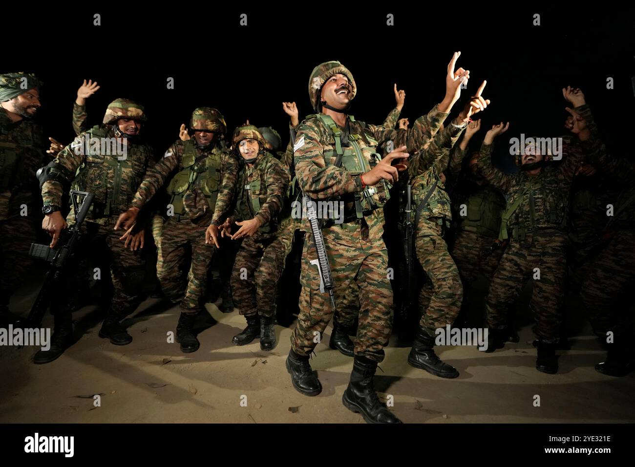 Indian army soldiers dance to celebrate Diwali, near the Line of ...