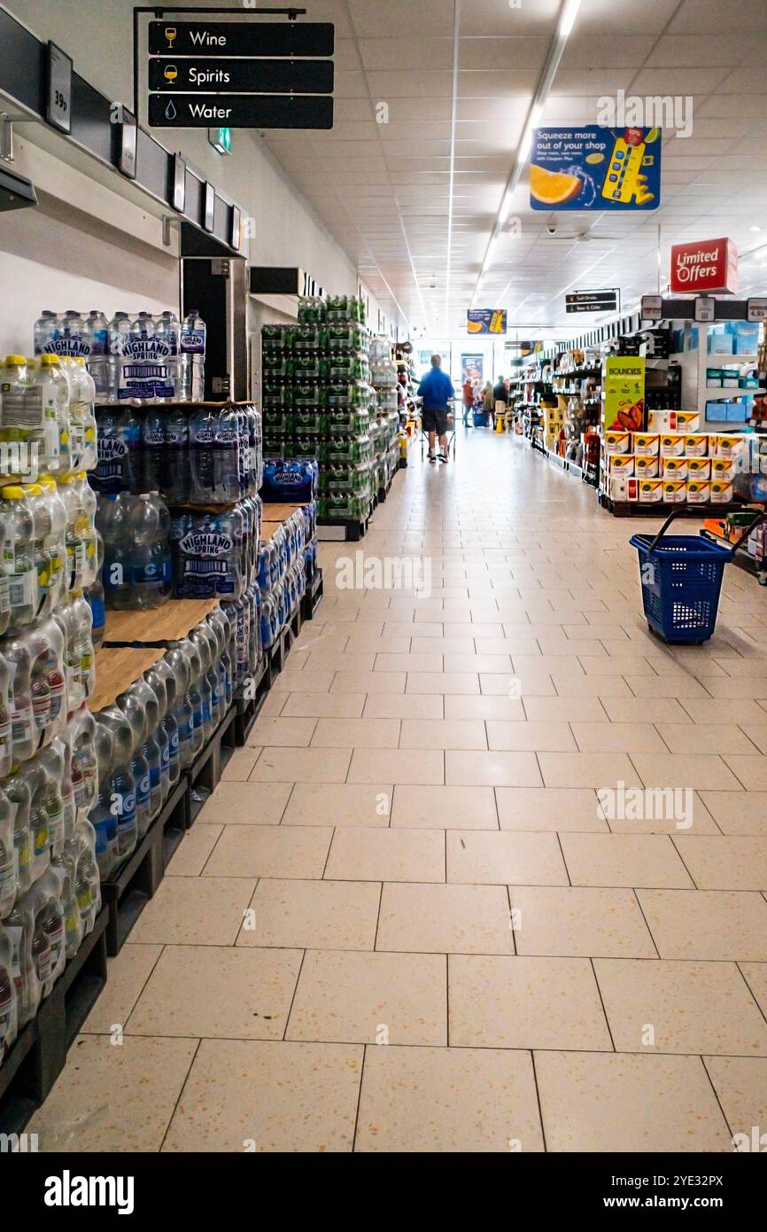 Shoppers customers people shopping inside a Lidl shop store in England ...