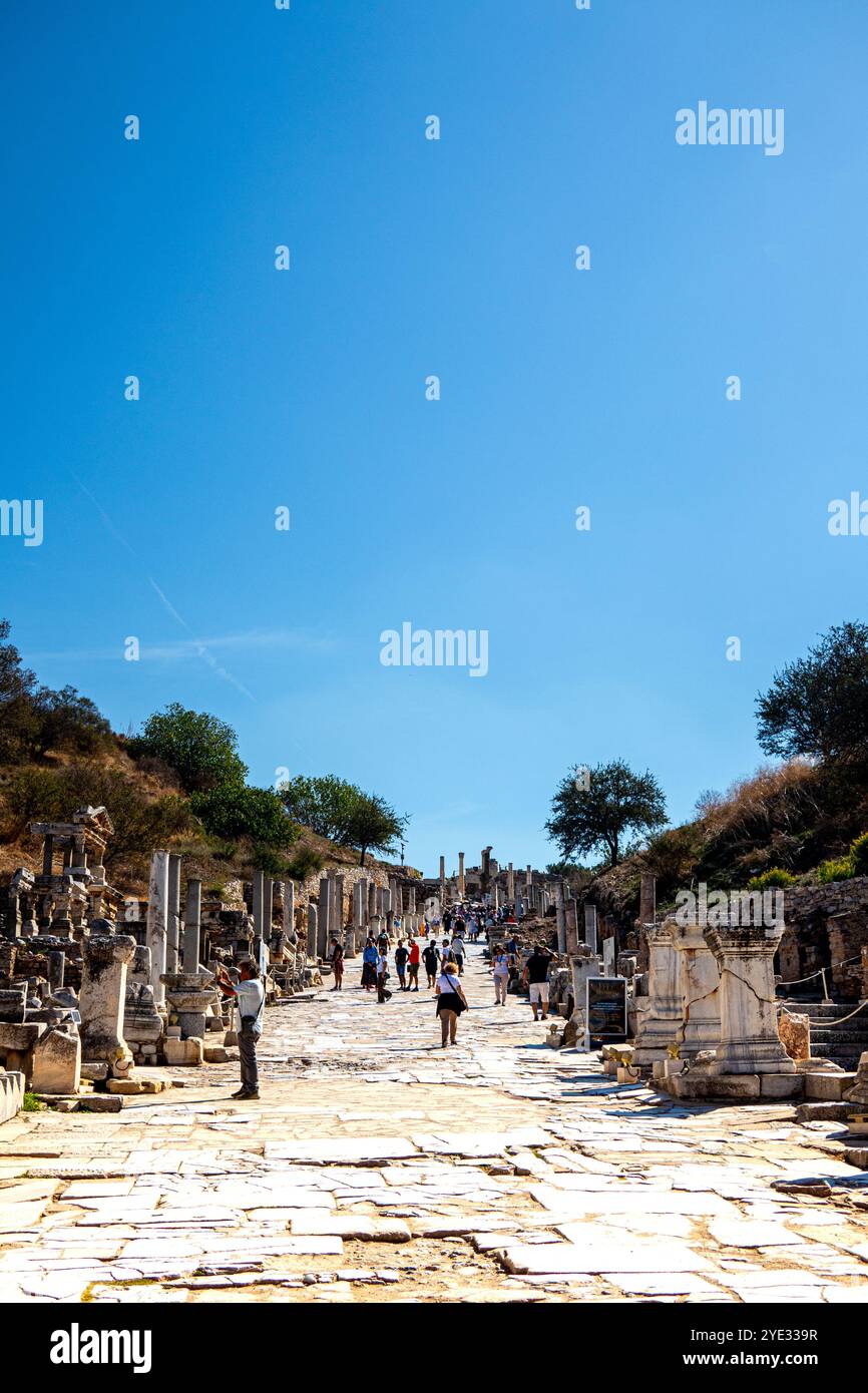 Visitors explore the ancient street and ruins of Ephesus Turkey Stock ...
