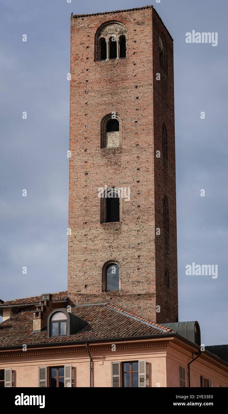 The tall brick tower in Alba showcases several arched windows ...