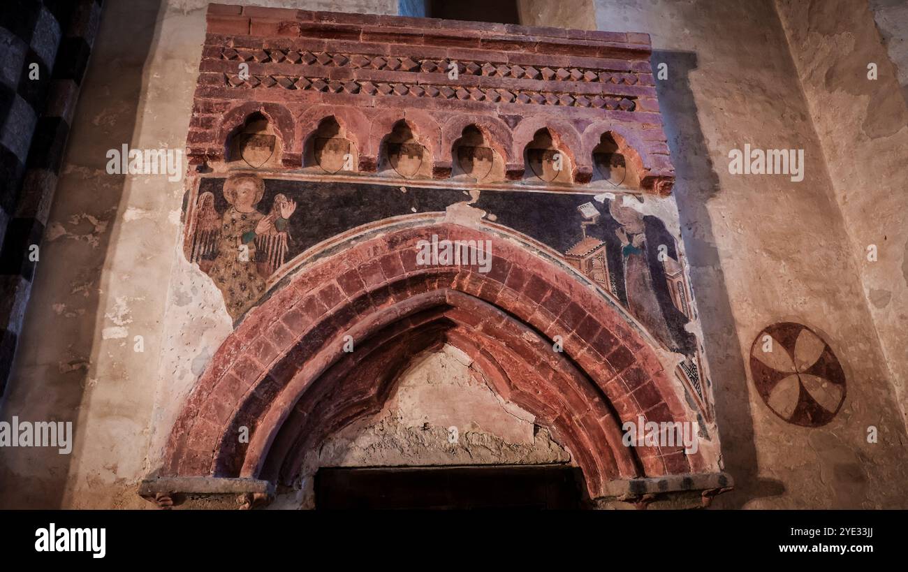 The vibrant frescoes adorn the walls of the ancient church in Alba ...