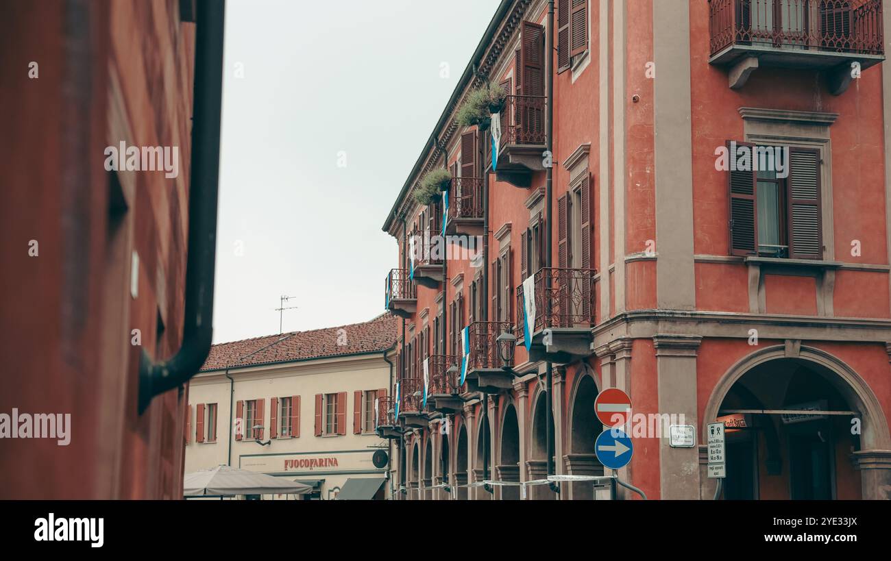 In Alba, Italy, elegant buildings showcase colorful facades and ...