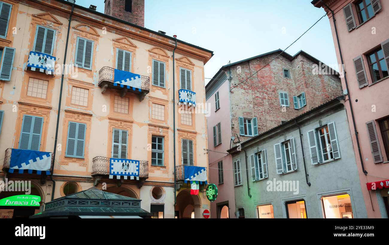 Twilight casts a gentle glow on charming buildings in Alba, Italy Stock ...
