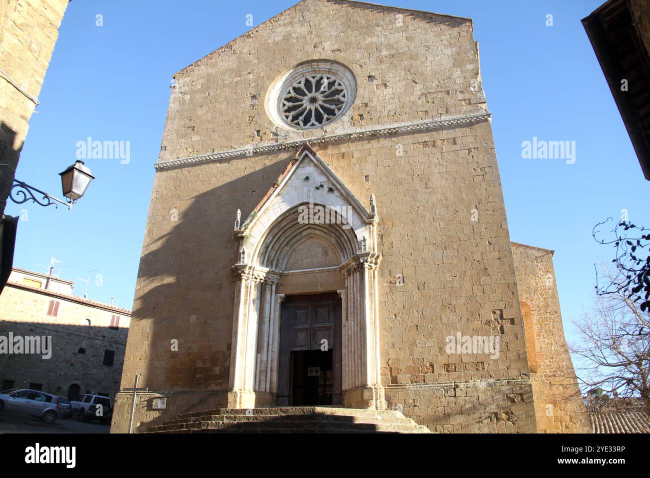 Monticchiello, Italy. Exterior view of the church of the medieval-era ...