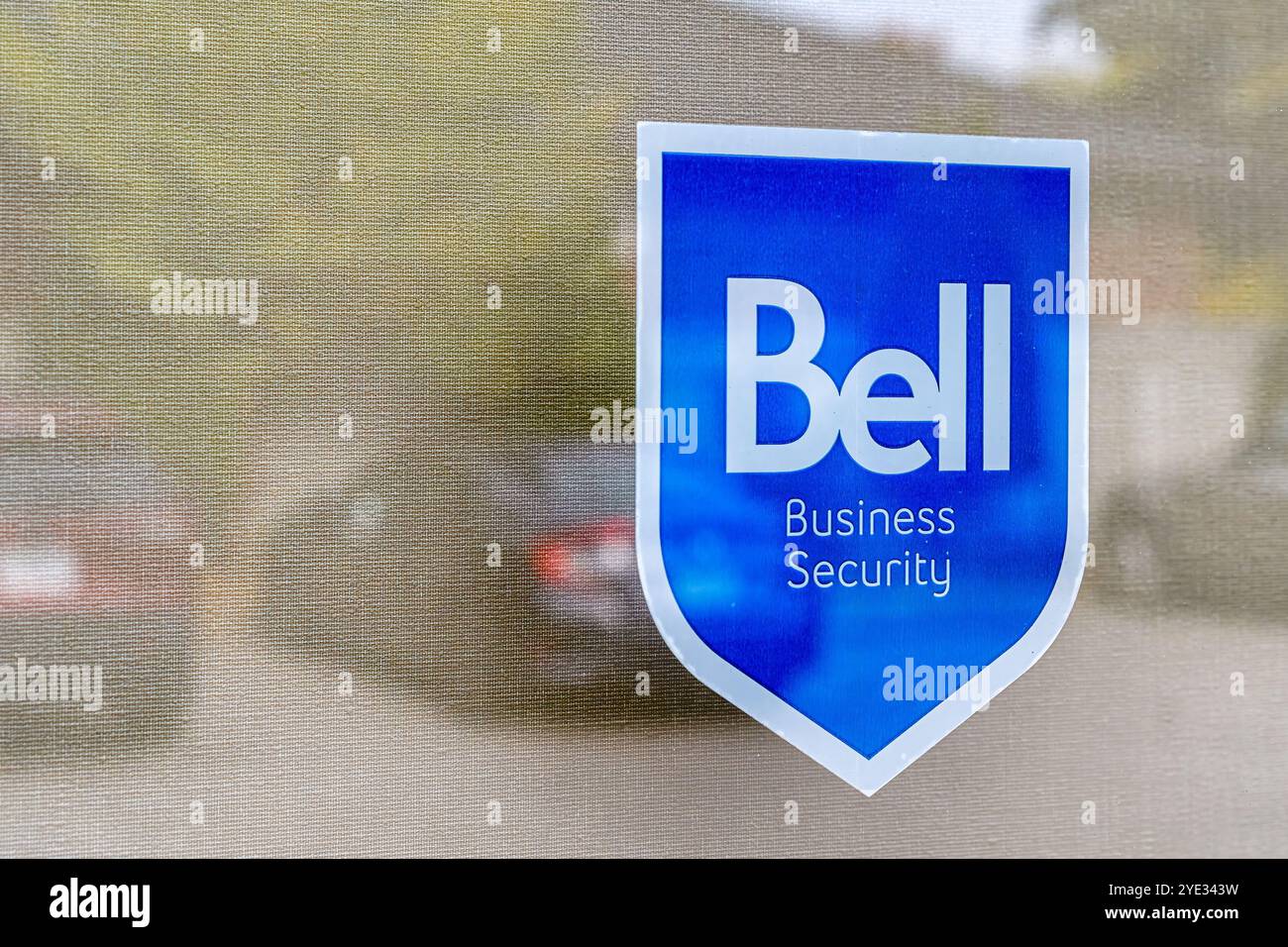 Bell Security Business sticker on a window, with car reflections ...