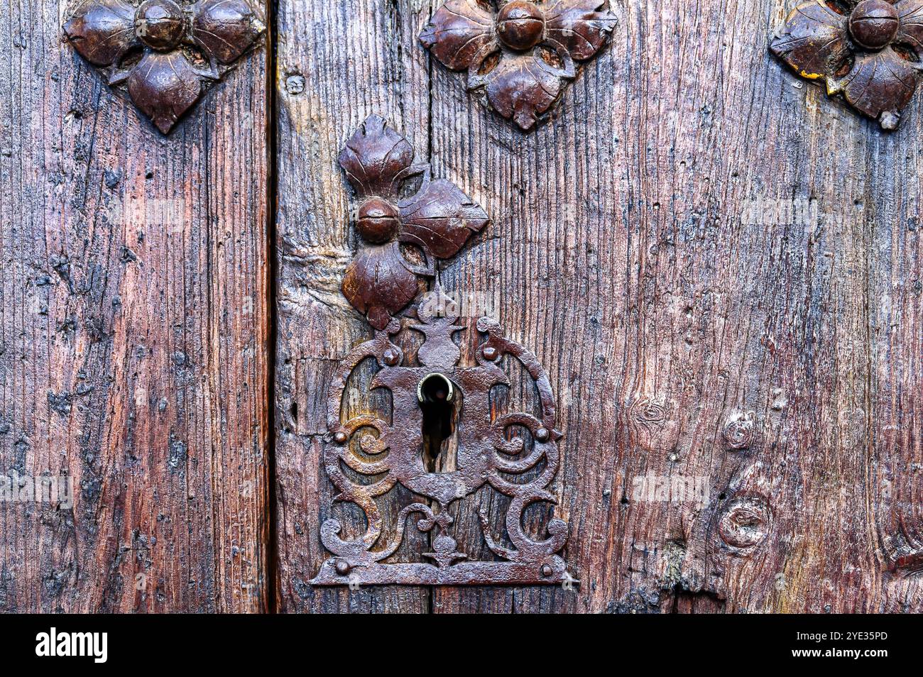 Avila, Spain - February 11, 2023: Ancient metallic keyhole and rivets ...
