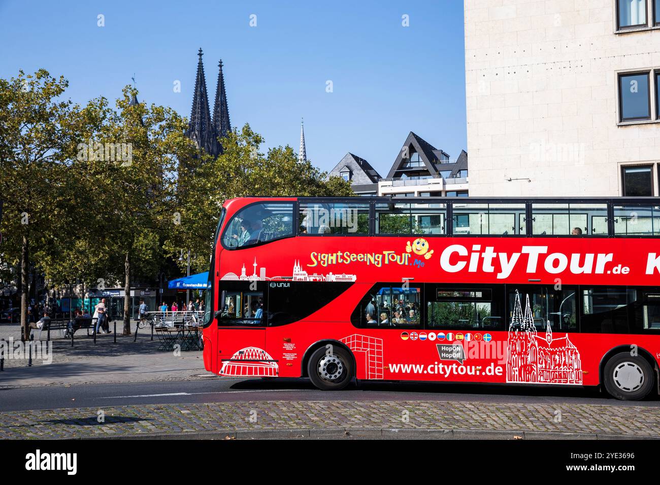 sightseeing bus at the Heumarkt, view to the cathedral, Cologne ...