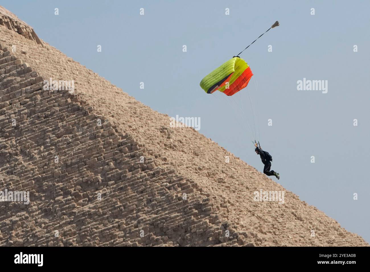 A skydiver parachutes at the historical site of Giza Pyramids, on the ...