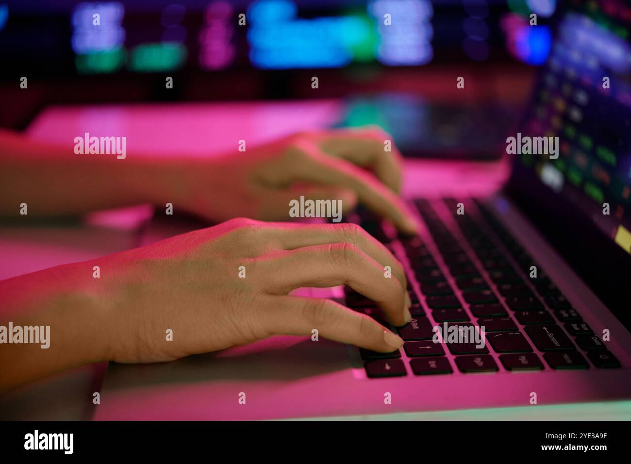 Typing on Laptop Keyboard in Dark Room Setting Stock Photo - Alamy