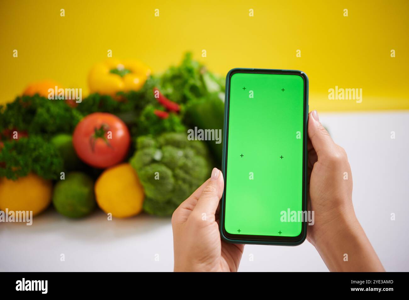Capturing Fresh Vegetables with a Green Screen Smartphone Stock Photo ...