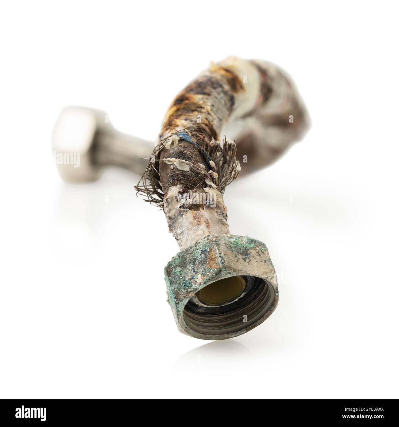 A water hose damaged by time with traces of corrosion, deformation of ...