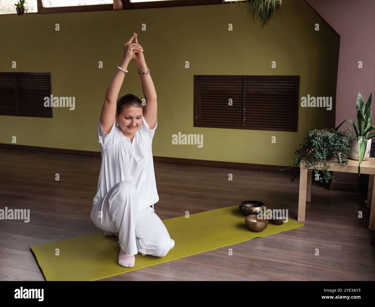 Woman doing kriya yoga exercise hi-res stock photography and images - Alamy