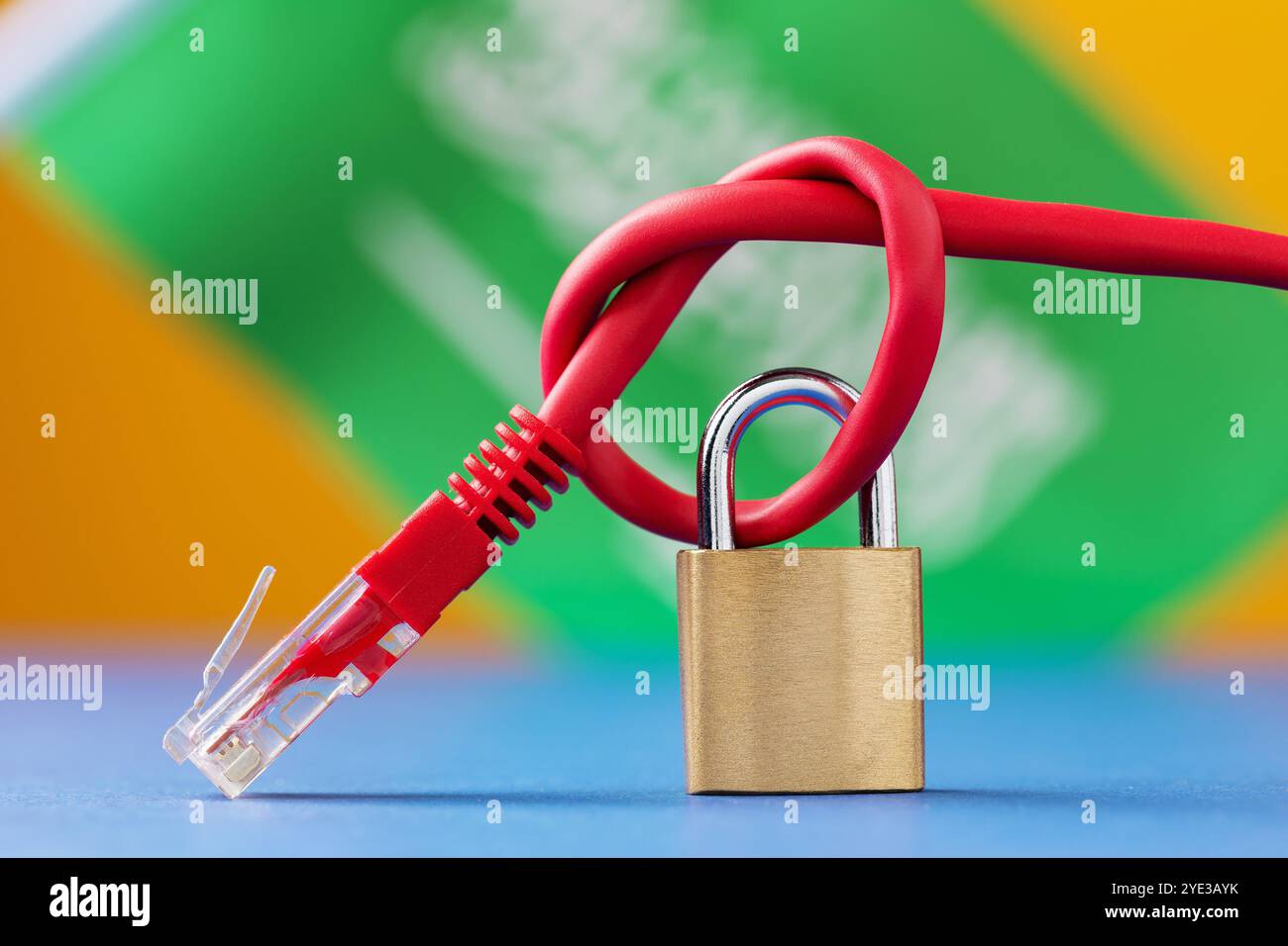 A closed lock on a tied network wire in a knot on the background of the ...