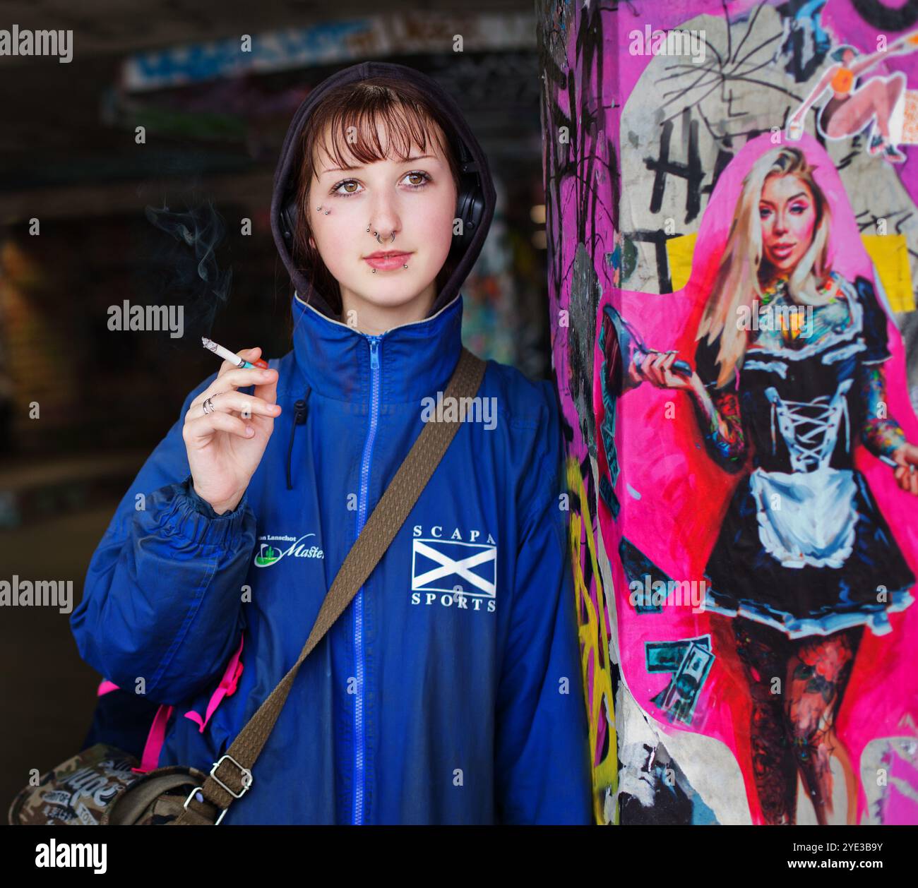 A girl with piercings smoking a cigarette at the southbank skatepark in ...