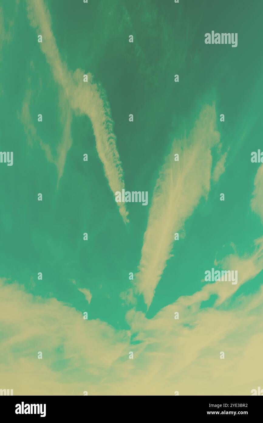Vertical background of vintage emerald sky with white clouds Stock ...