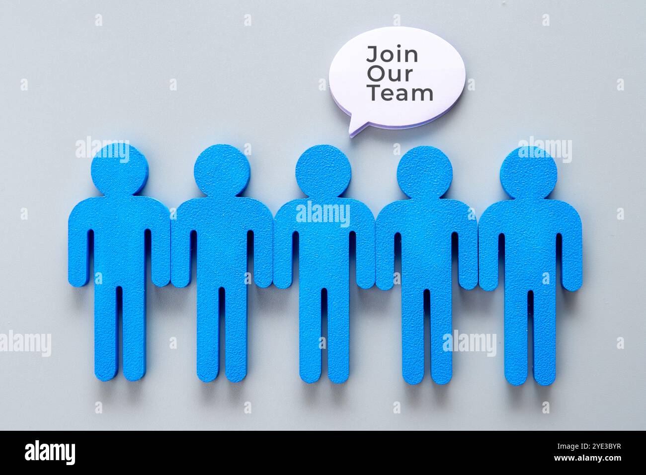 A row of blue figures with a speech bubble saying "Join Our Team ...