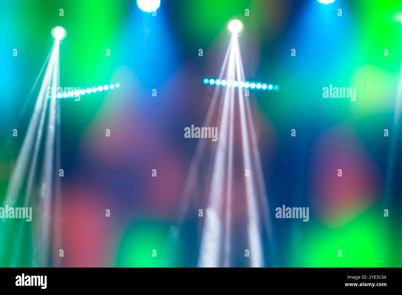 Abstract multicolored disco background with lights beams of white light ...