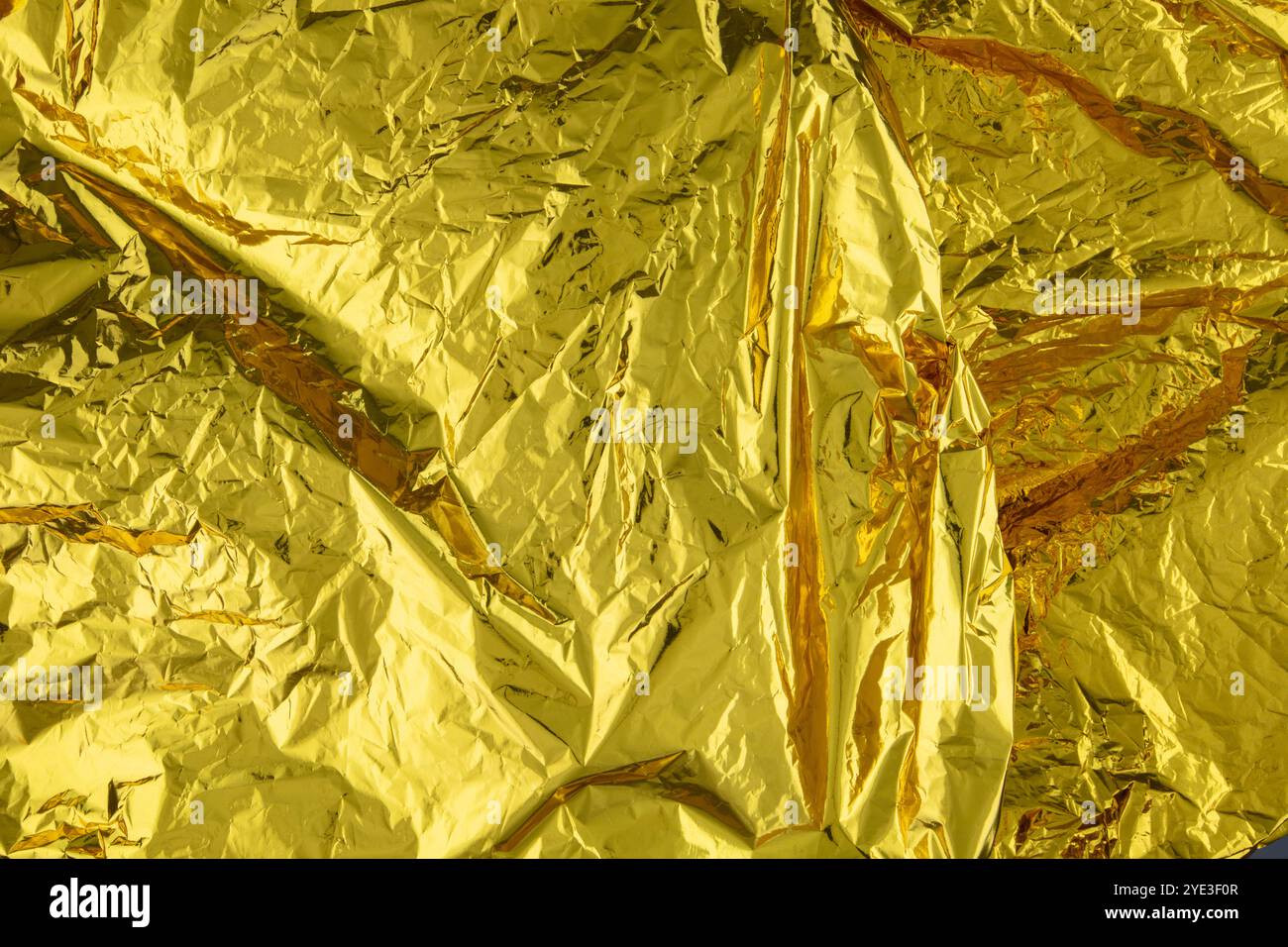 Texture of crumpled gold foil paper Stock Photo - Alamy