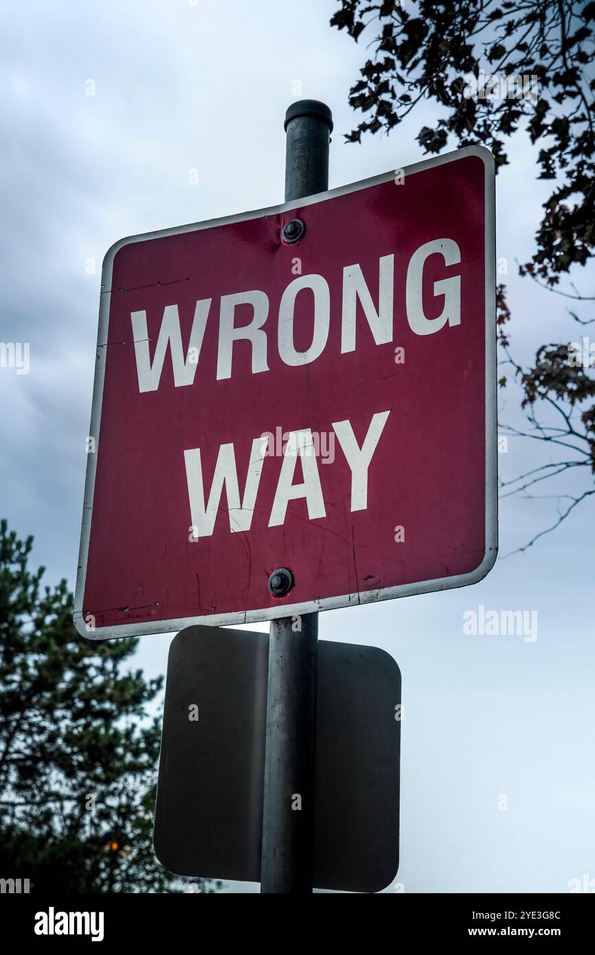 Wrong way sign warning you to change your tune Stock Photo - Alamy