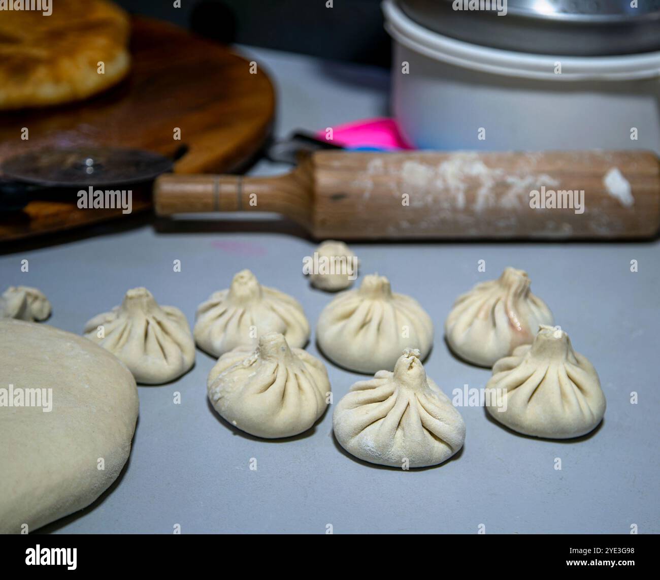 Traditional Georgian Khinkali is being made in the kitchen. Khinkali ...