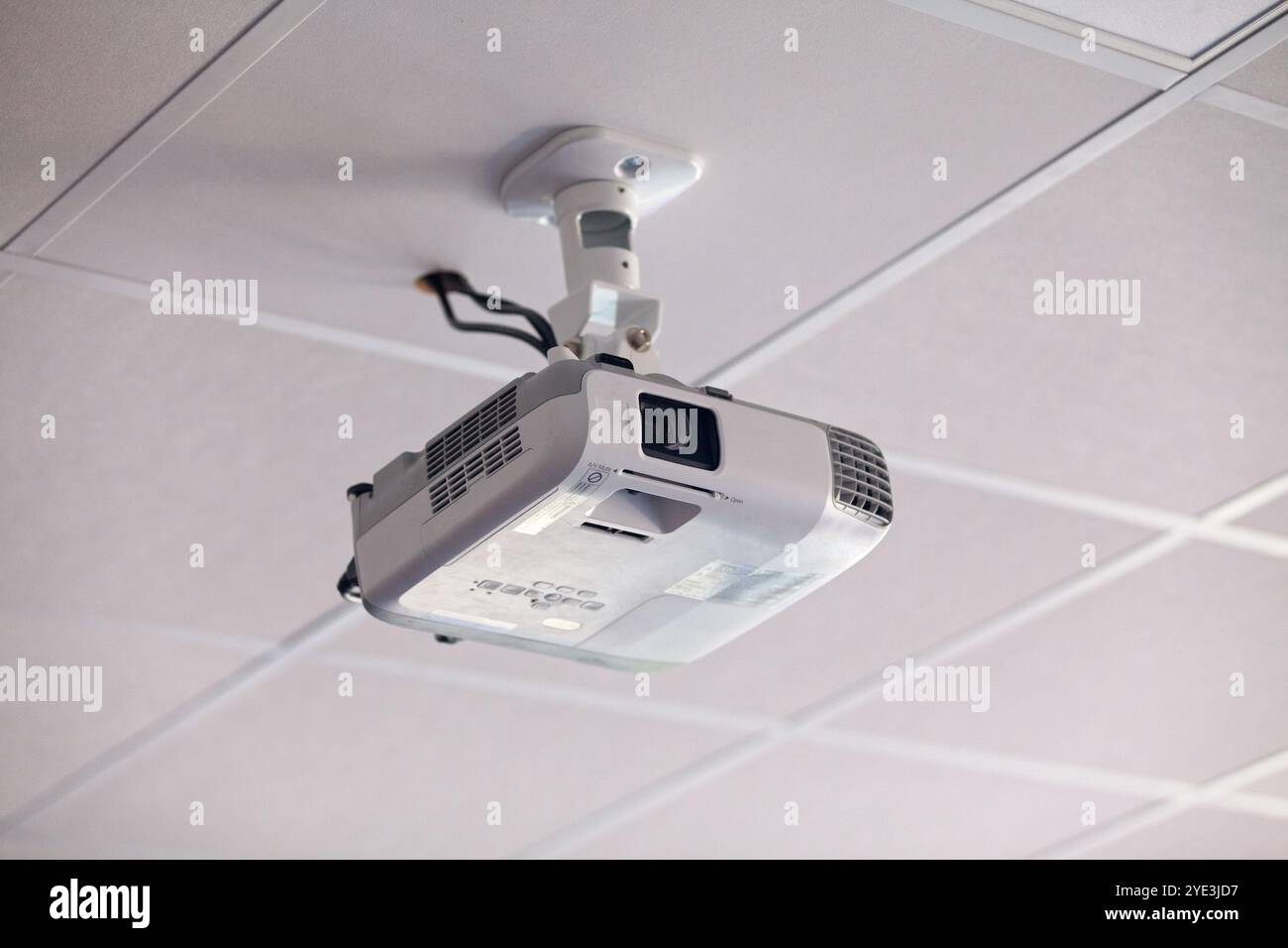 Digital projector attached to the ceiling of a conference room of an ...