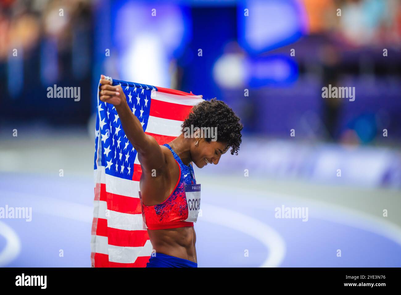 Anna Cockrell celebrating with her country's flag in the 400 meters ...