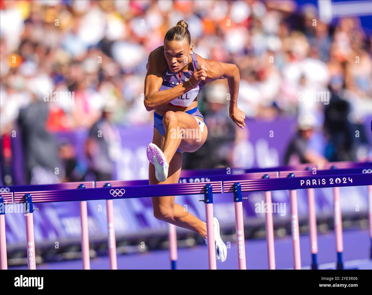 Anna Hall participating in the 100 meters hurdles at the Paris 2024 ...
