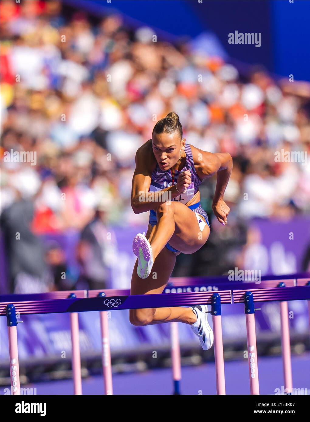 Anna Hall participating in the 100 meters hurdles at the Paris 2024 ...